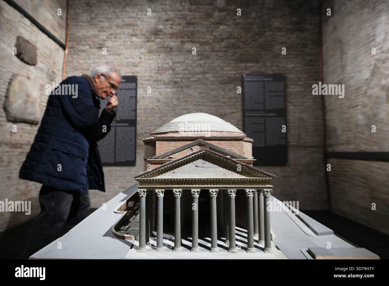 A man looks at a scale model of the Pantheon during a press preview for ...