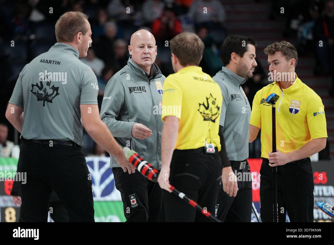 Kevin Koe, second from left, prepares to shake hands with Jordan ...