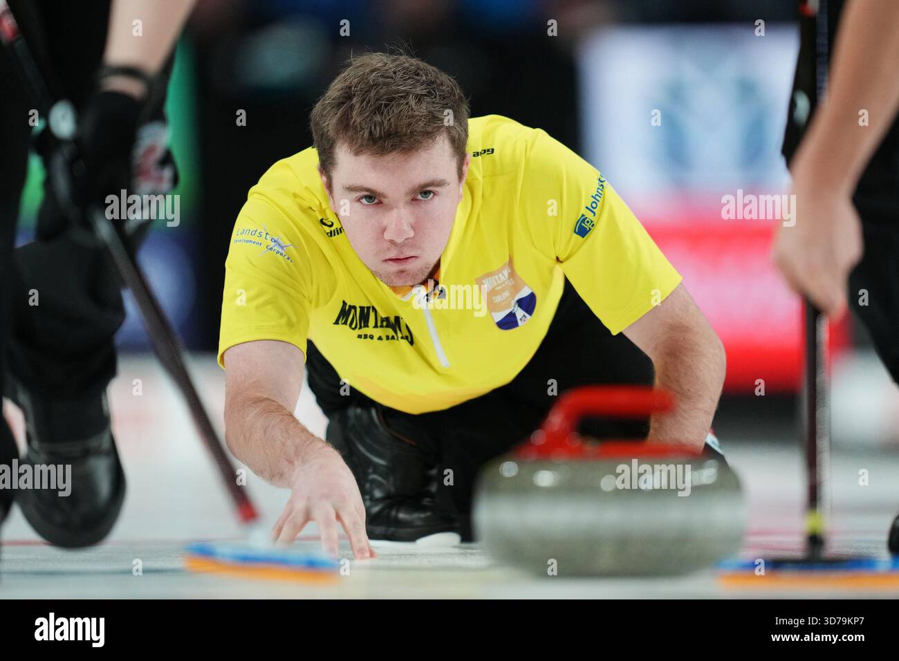 Jordan McDonald throws a rock against Team Koe during Canadian Olympic ...