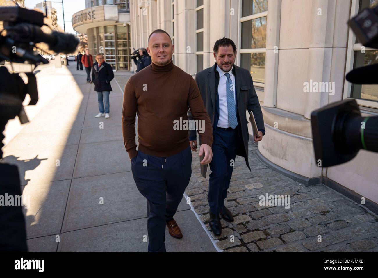 Shane Hennen leaves Brooklyn federal court, Monday, Nov. 24, 2025, in ...