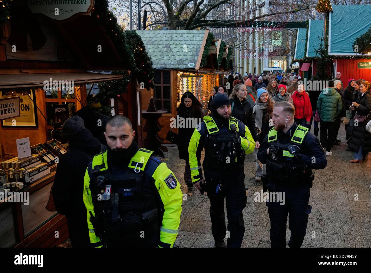 Police officers stand guard at a Christmas Market in Berlin, Germany ...