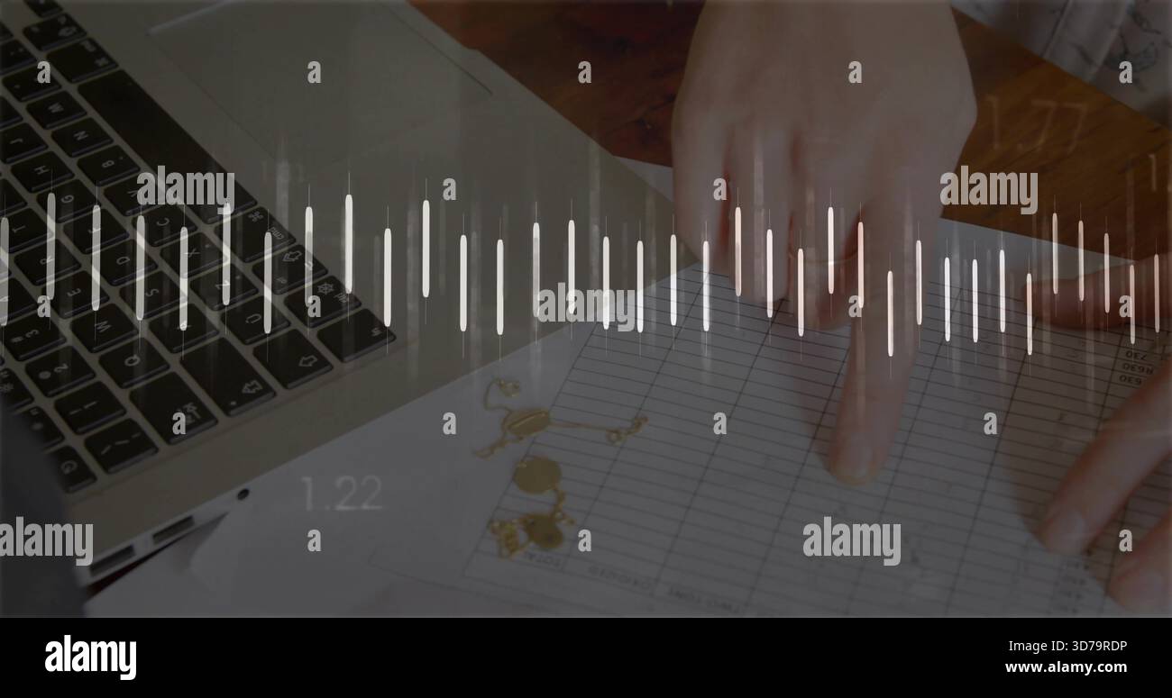 Tracing woman's hands marking ledger on wood desk, showing laptop ...