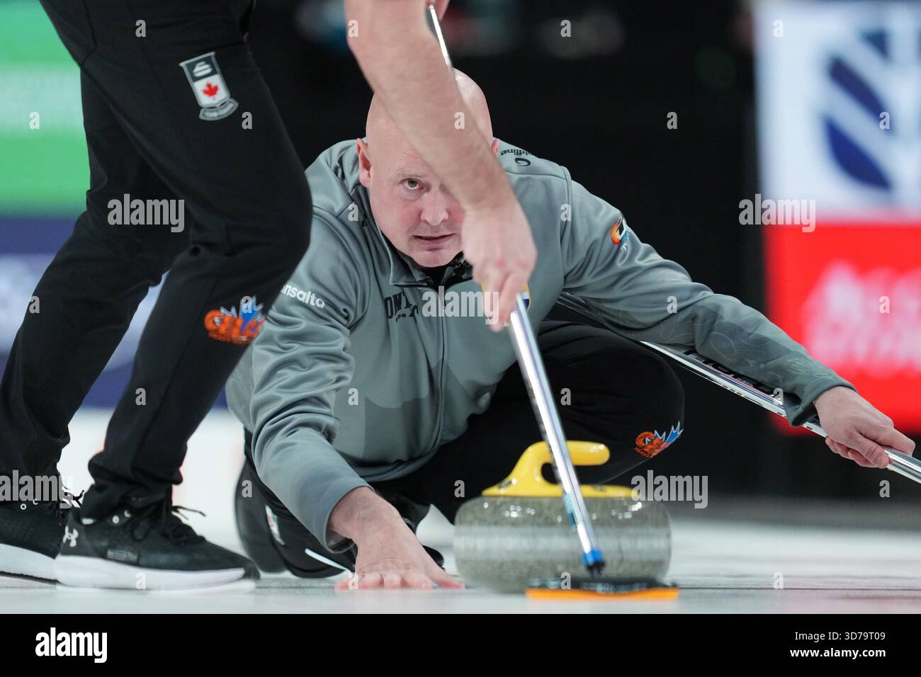 Kevin Koe throws a rock against Team McDonald during Canadian Olympic ...