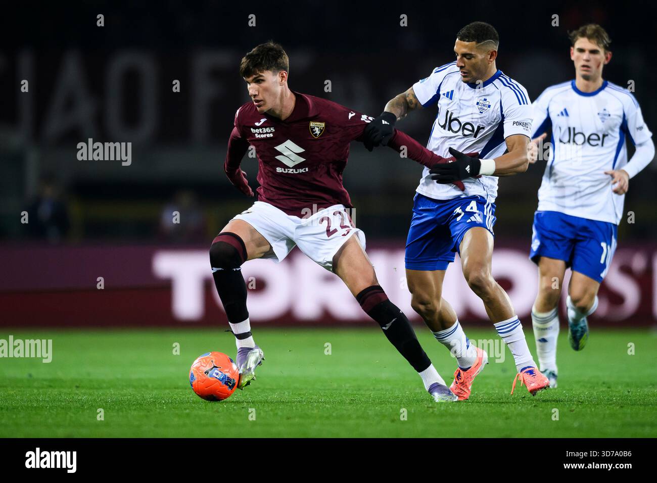 Cesare Casadei of Torino FC competes for the ball with Diego Carlos of ...