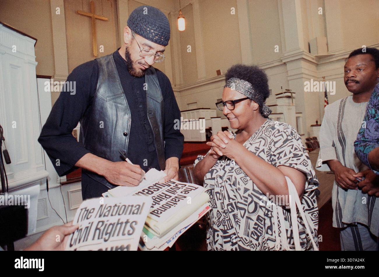 FILE - Jamil Al-Amin, formerly known as H. Rap Brown, signs a program ...