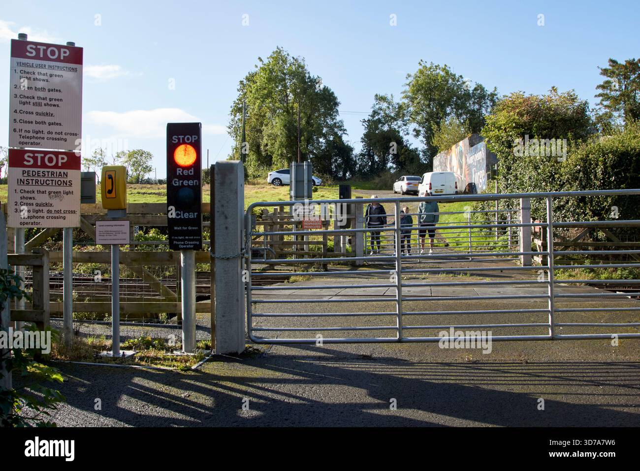 people waiting at moneypennys level crossing unmanned remote railway ...