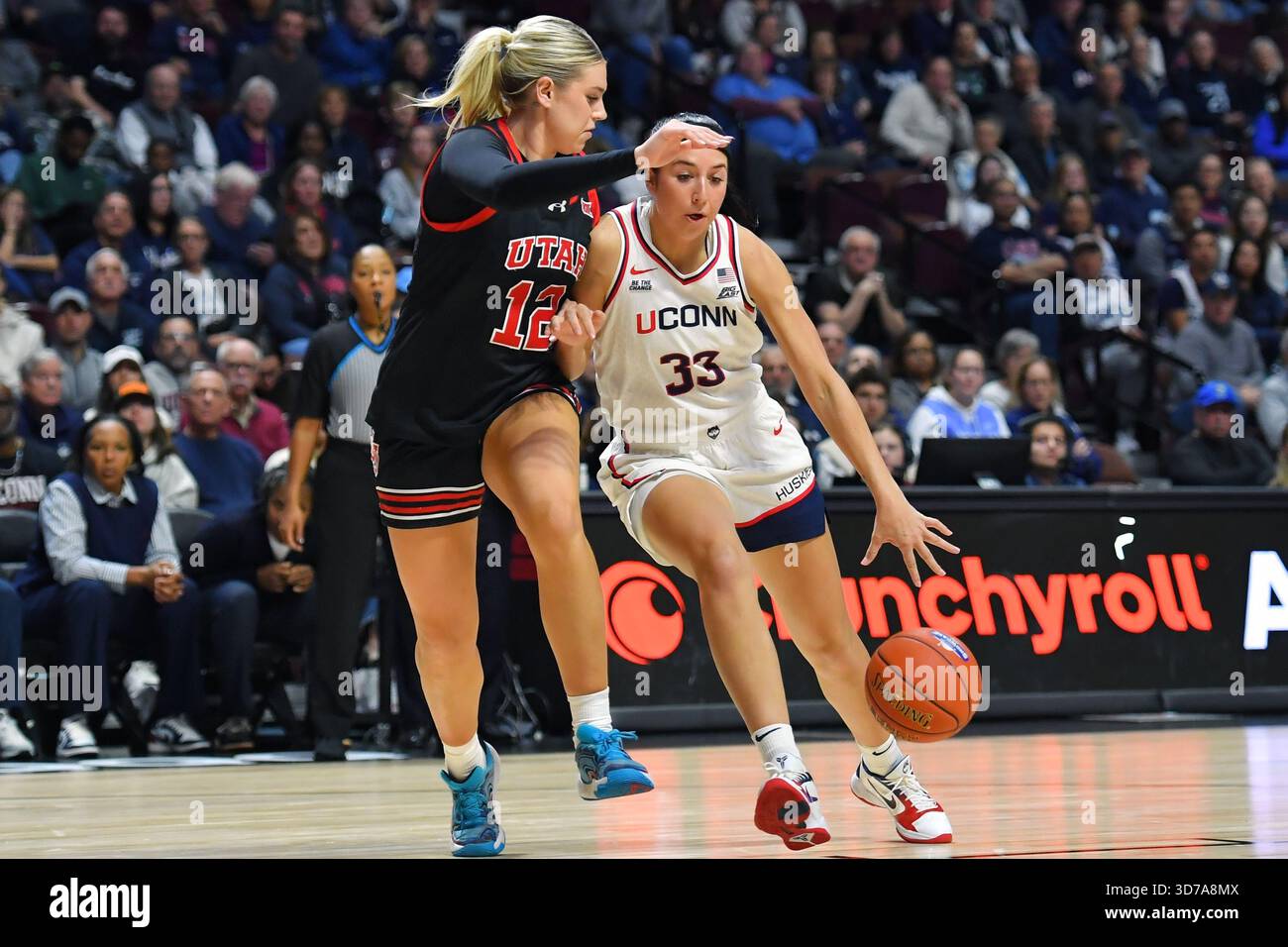 UConn guard Caroline Ducharme (33) drives with the ball as Utah forward ...