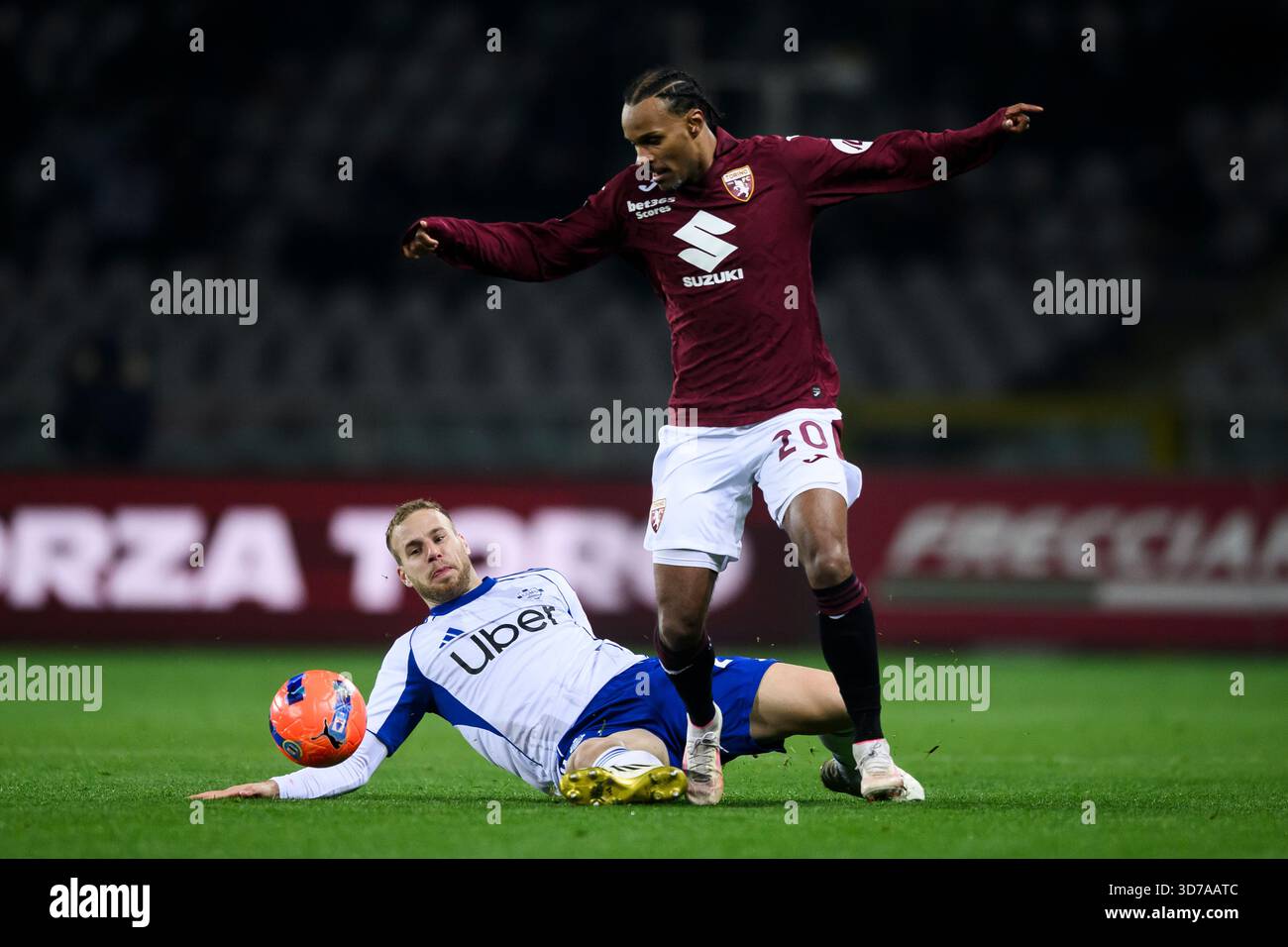 Valentino Lazaro of Torino FC is tackled by Ivan Smolcic of Como 1907 ...
