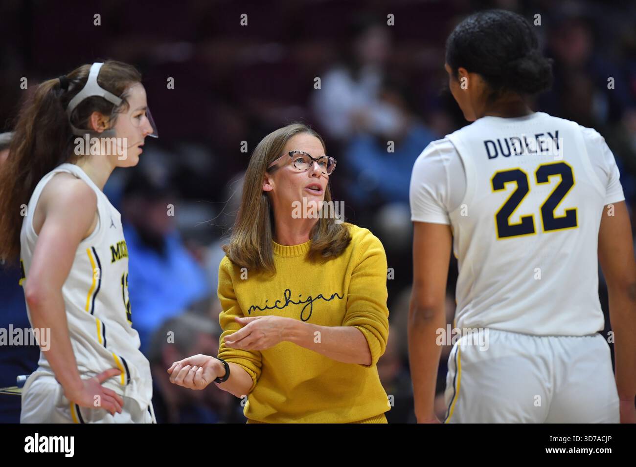 Michigan head coach Kim Barnes Arico, left, speaks with Michigan guard ...