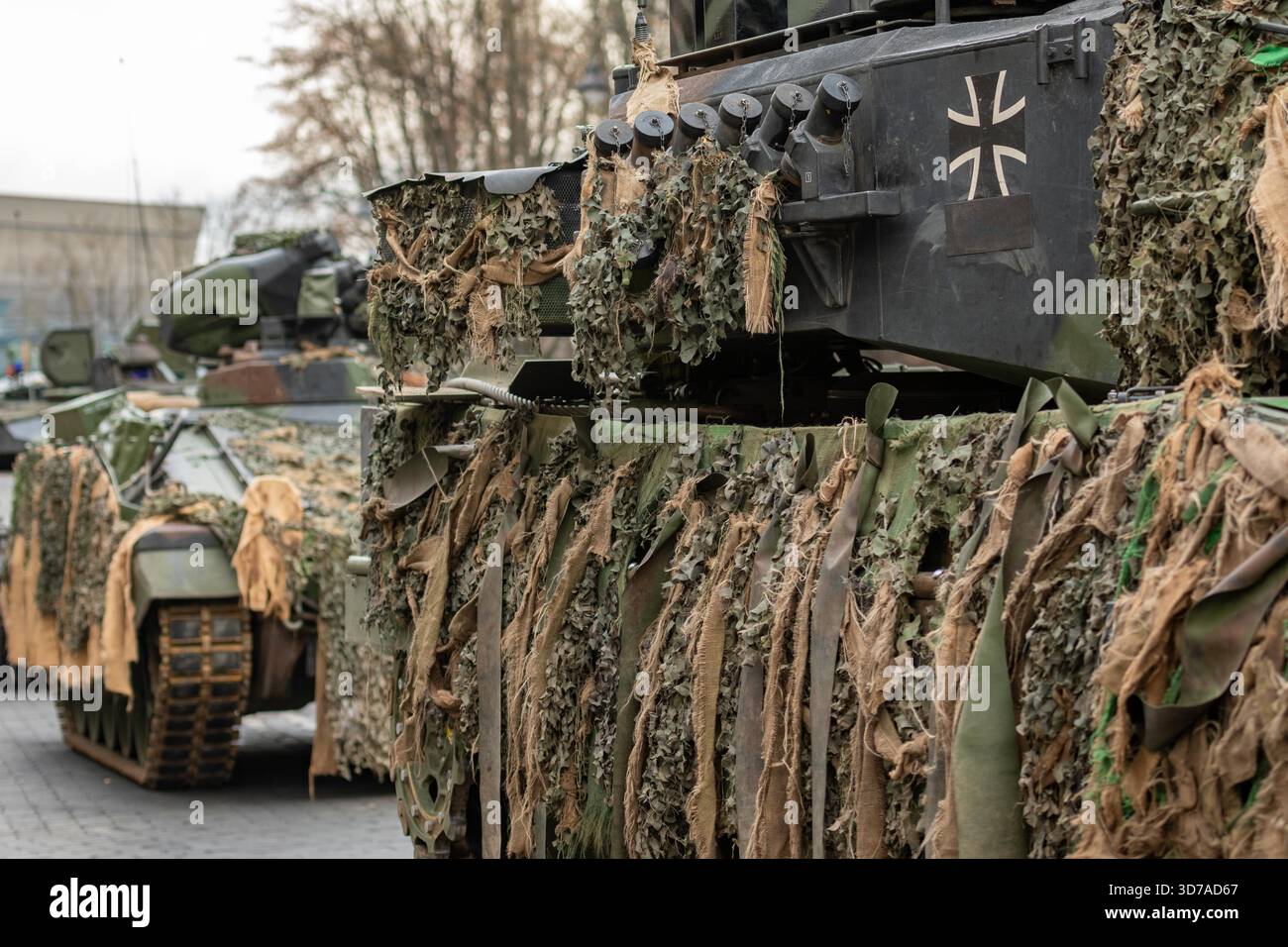 Column of German Army armored Leopard tanks moving on the road with the ...