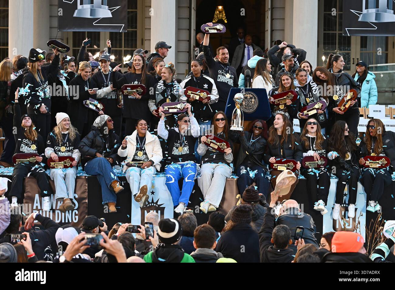 Member of the NY/NJ Gotham FC celebrates with the trophy during the ...