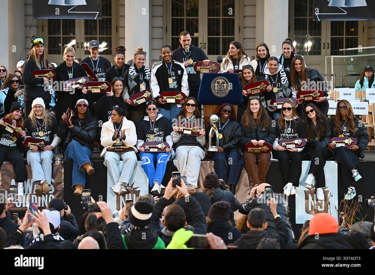 Member of the NY/NJ Gotham FC celebrates with the trophy during the ...