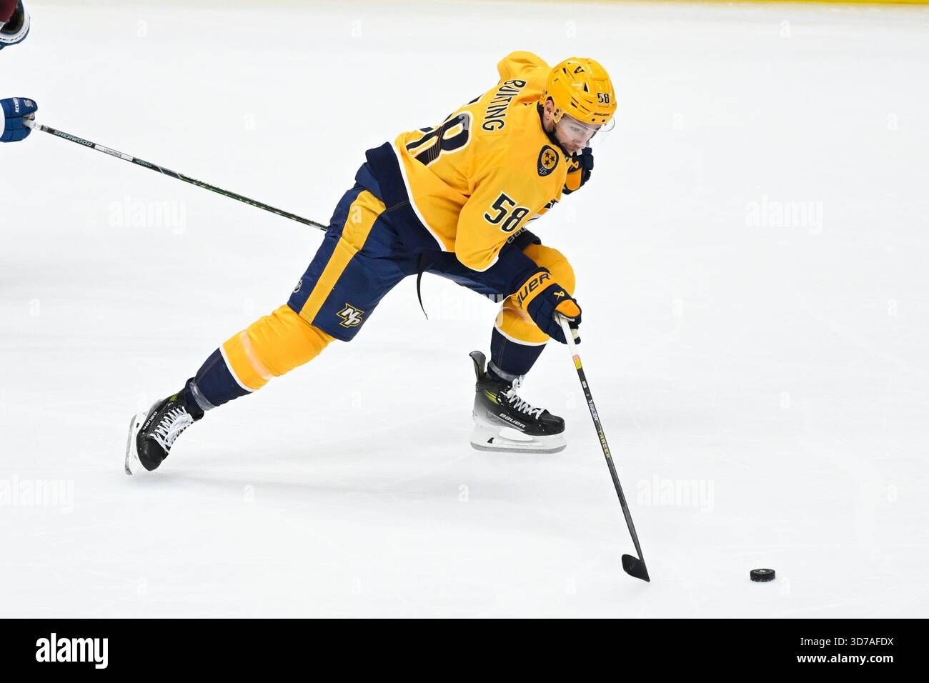 Nashville Predators left wing Michael Bunting (58) plays the Colorado ...