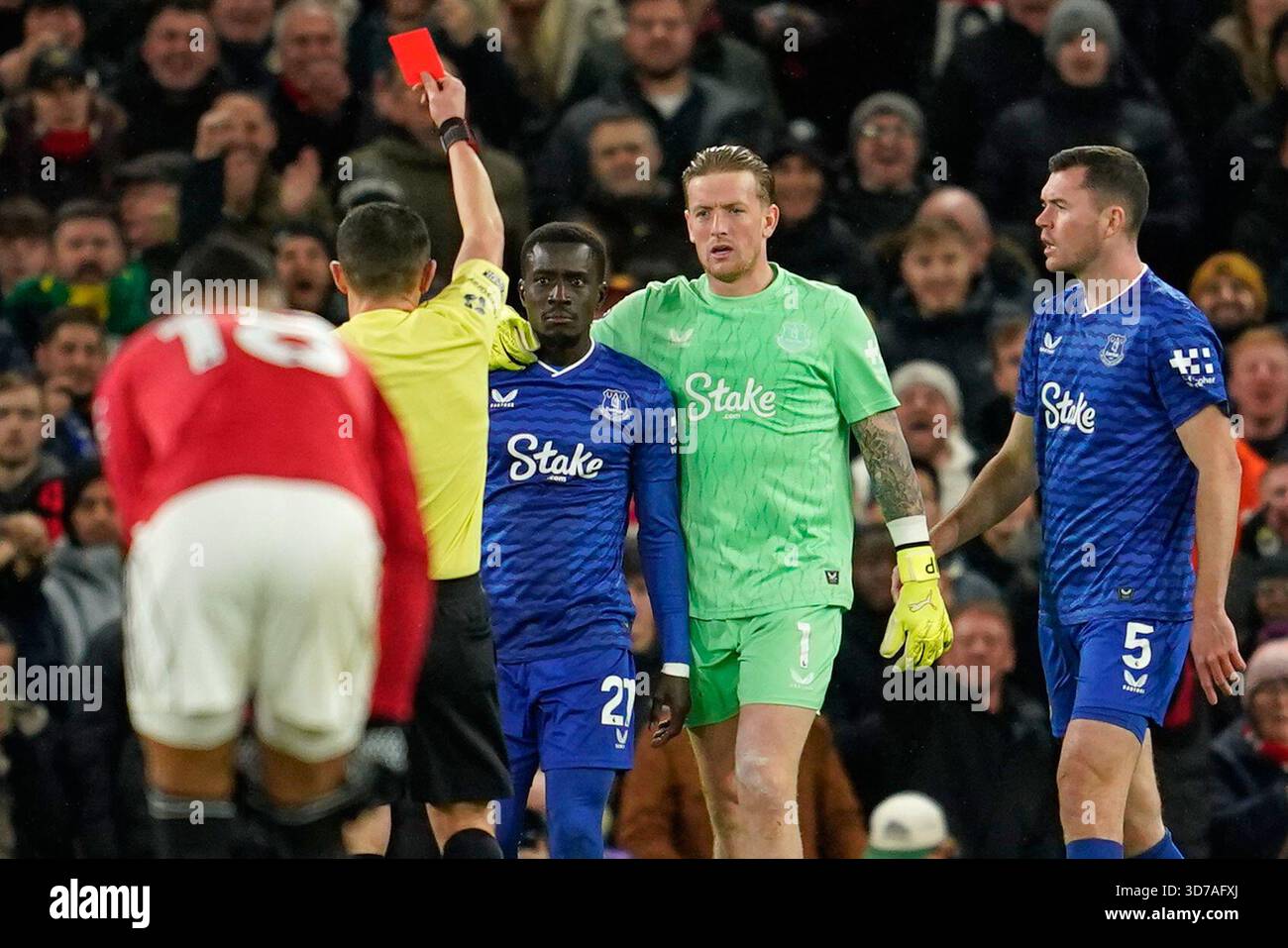 Everton's Idrissa Gueye, third right, gets a red card from referee Tony ...