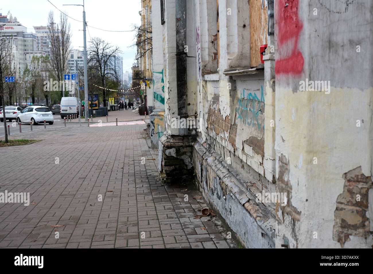 Old buildings show signs of wear, while life moves forward on the busy ...