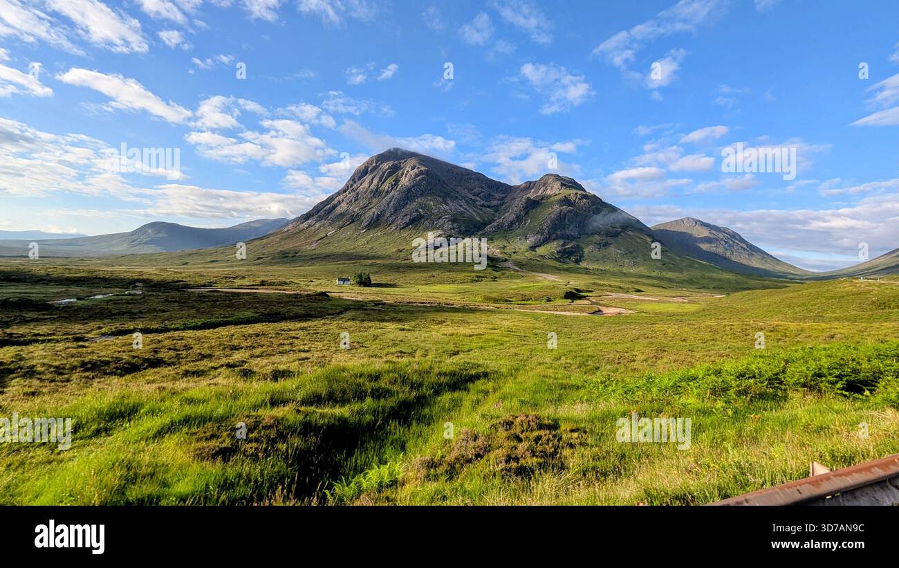Iconic green mountains of Glencoe captured on a bright and beautiful ...