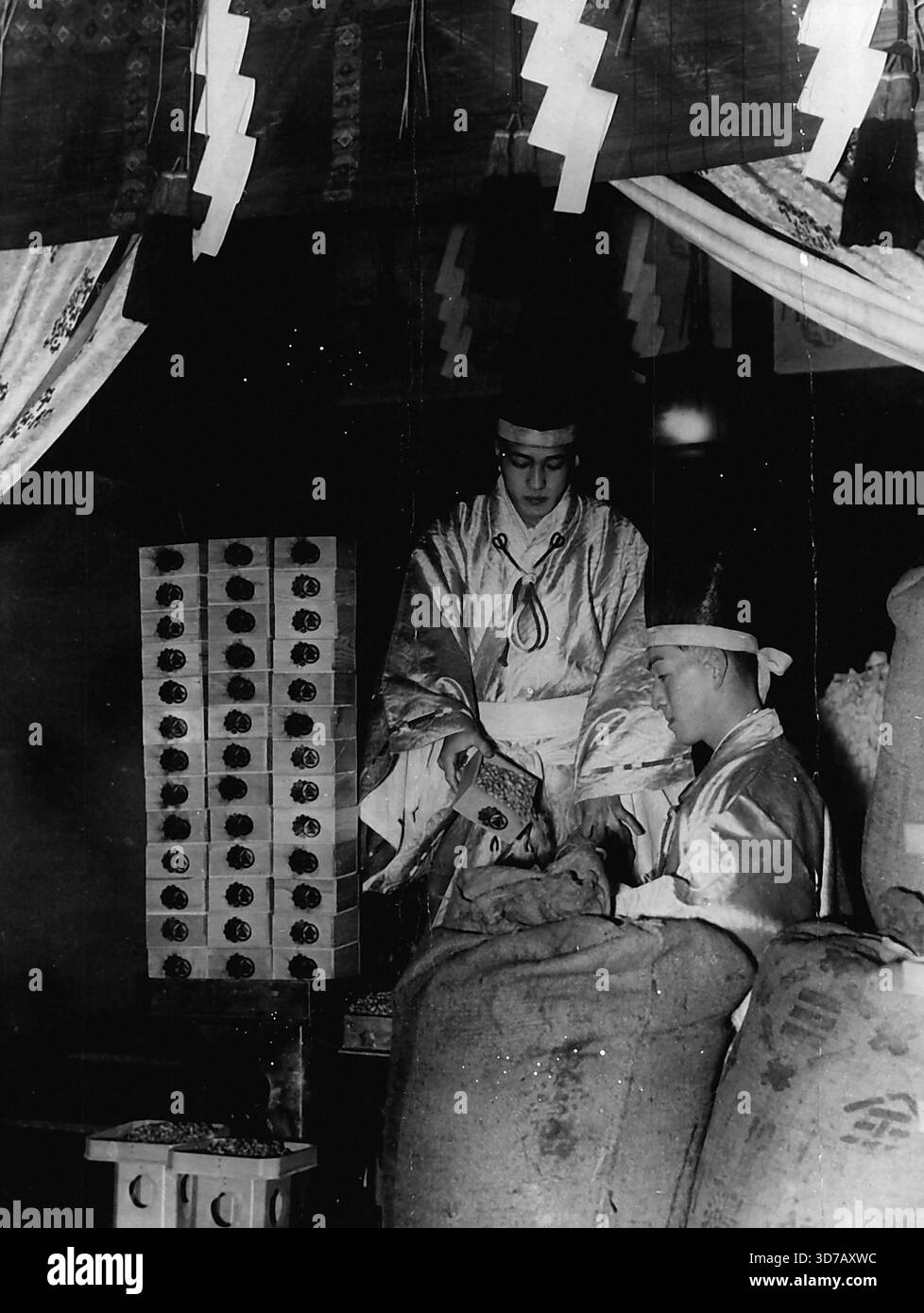 At the Kotohira Shire, Tokio, priests distribute beans at the entrance ...