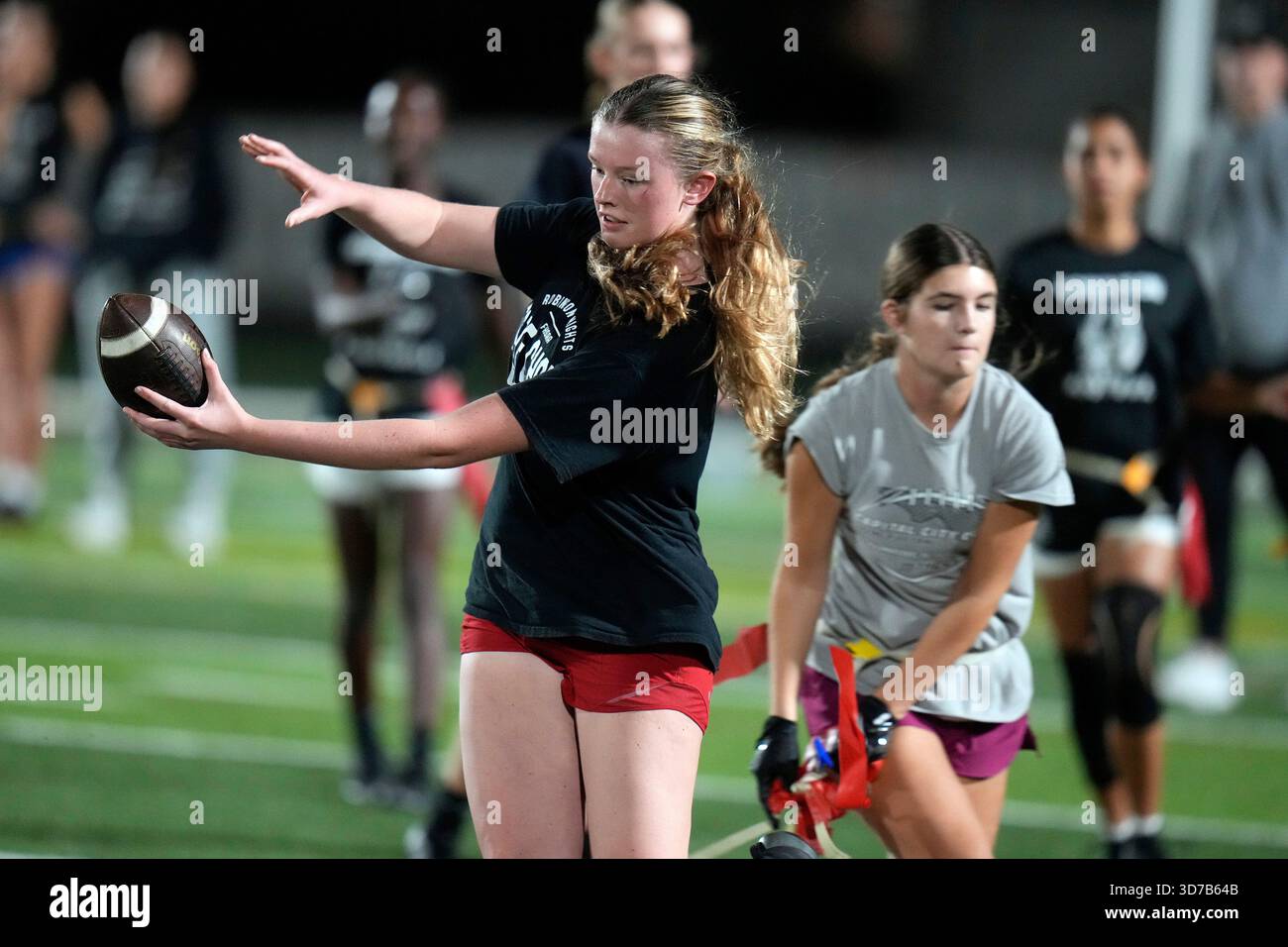 Robinson High School girls flag football players run through a wide ...