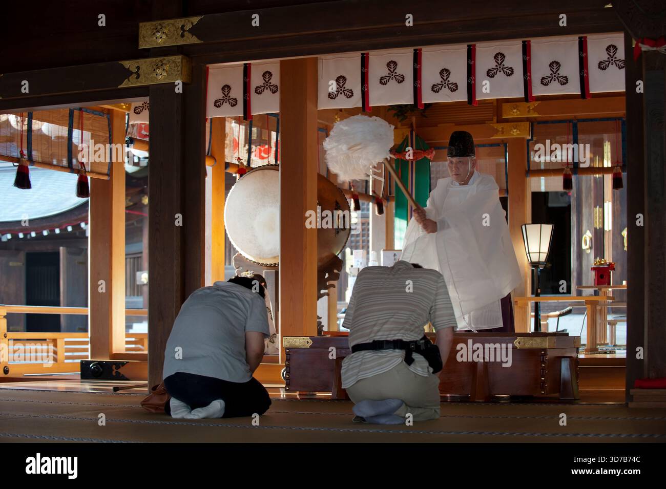 Japanese worshipers inside the Taga Taisha Shinto shrine where a priest ...