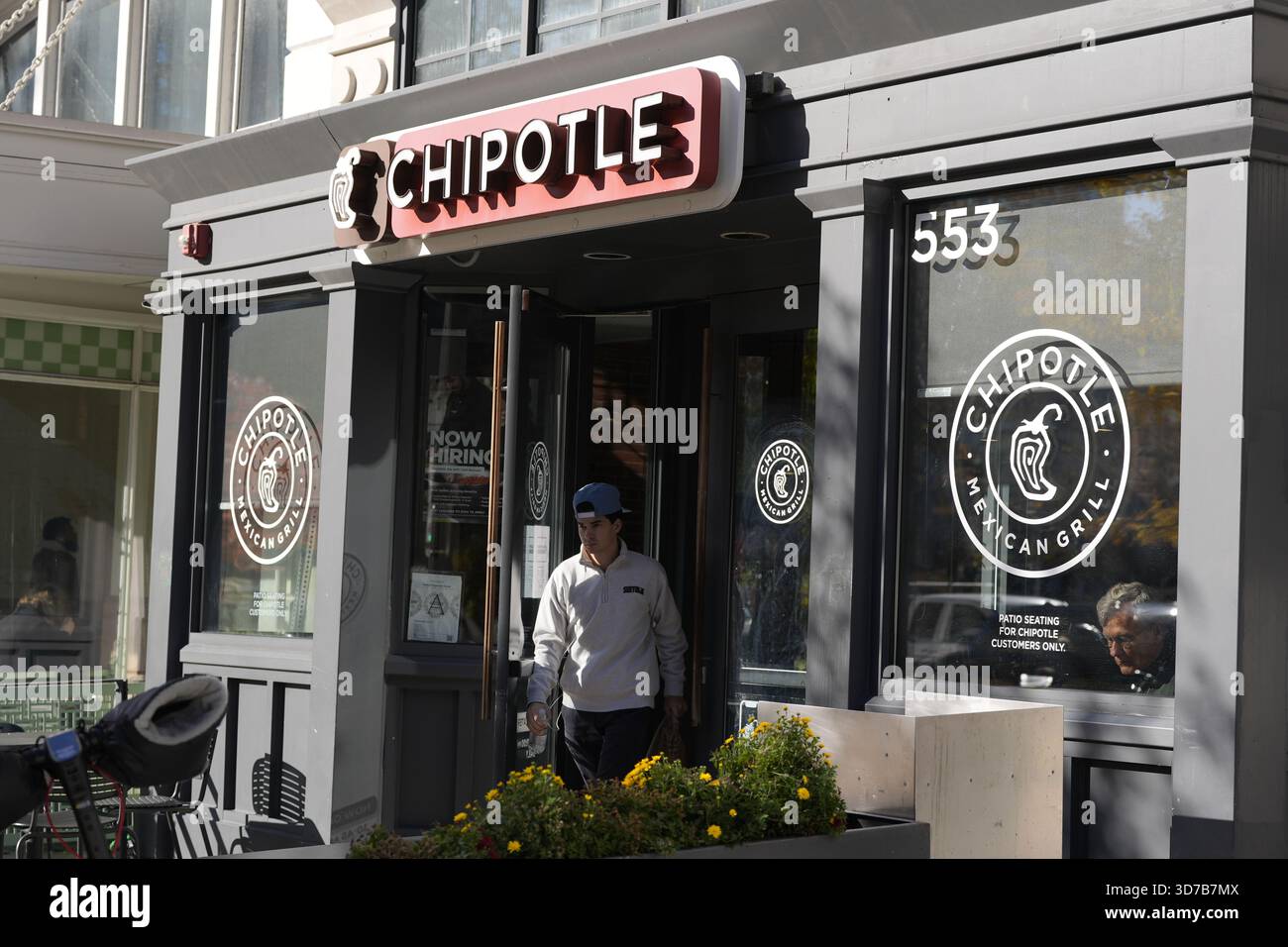 A customer leaves the Chipotle restaurant, Monday, Nov. 24, 2025, in ...