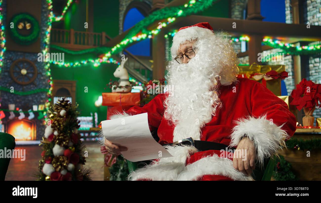 Man dressed as Santa Claus sleeping in chair, exhausted after children ...