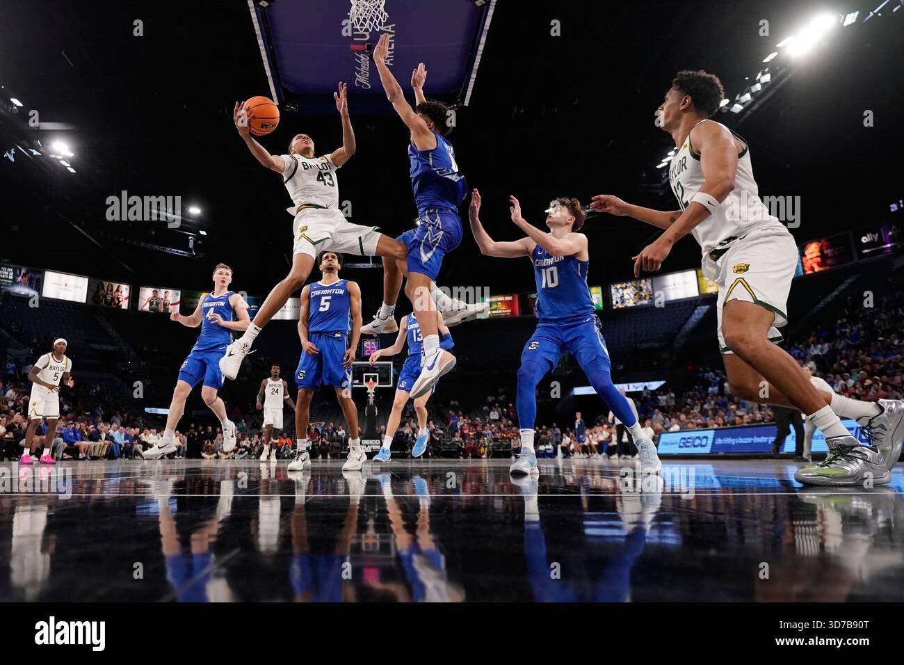Baylor guard Cameron Carr (43) drives to the basket against Creighton ...