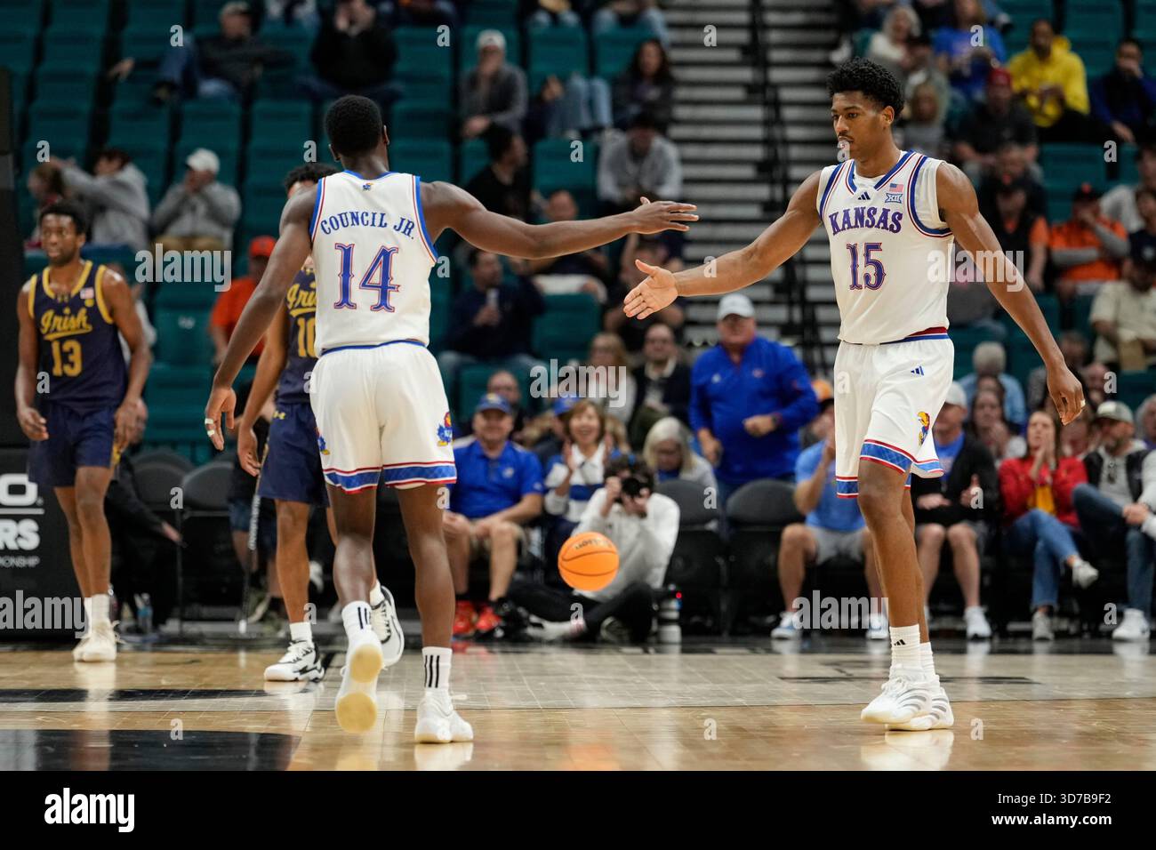 Kansas forward Bryson Tiller (15) celebrates with guard Melvin Council ...