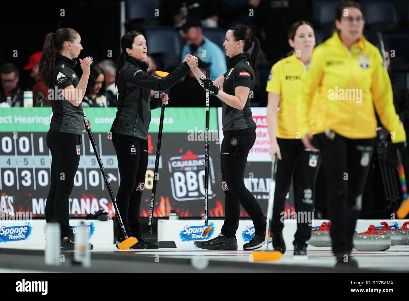 Kerri Einarson, second from left, celebrates with teammates Karlee ...