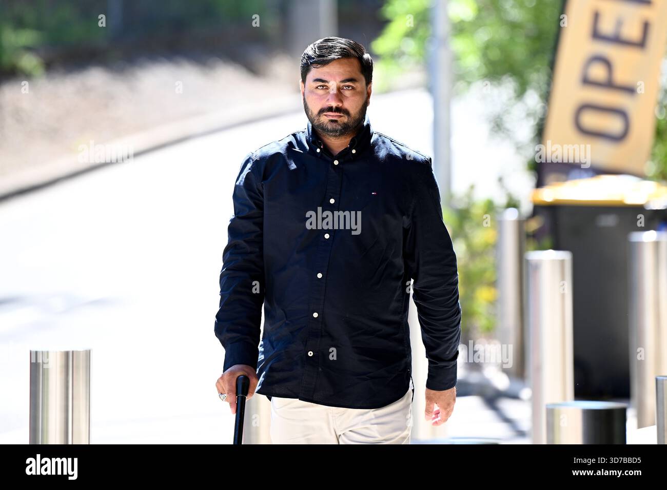 Muzafar Ahmad Tahir, brother of victim Faraz Tahir, arrives at the ...