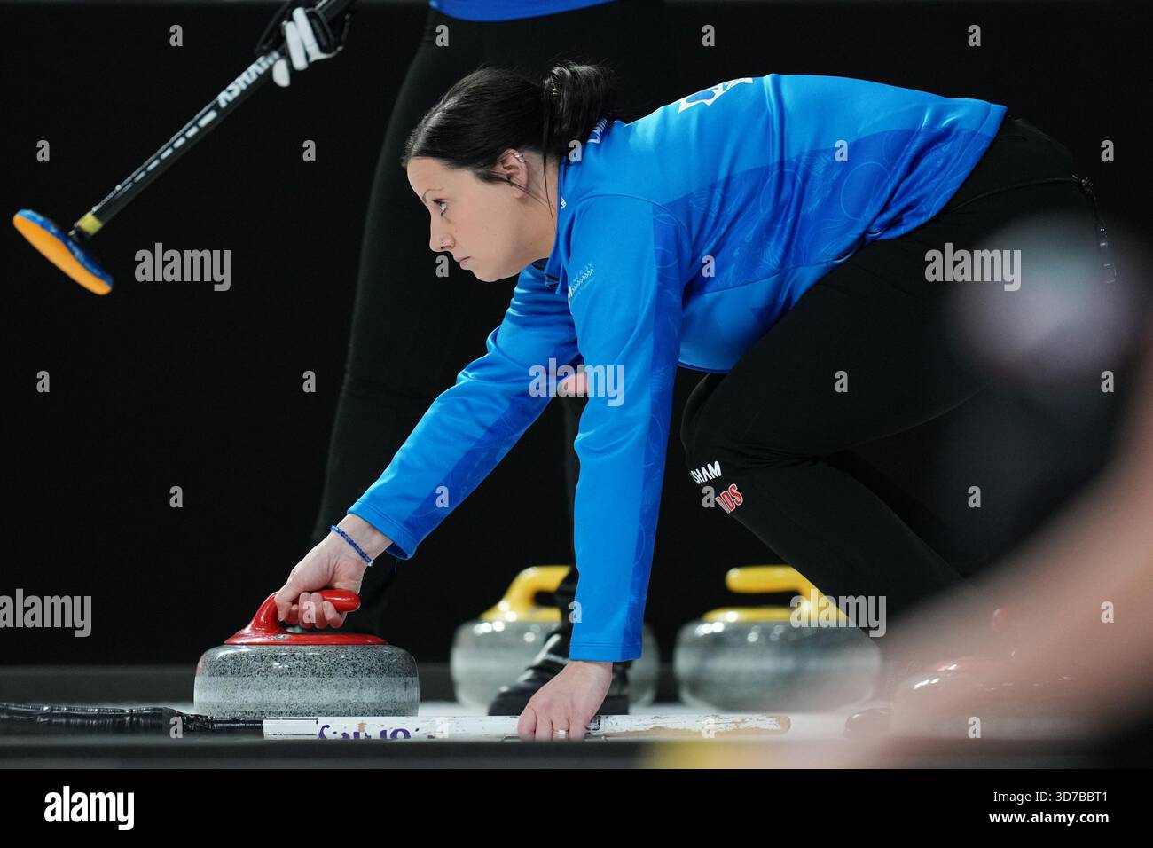 Kate Cameron delivers a rock during Canadian Olympic curling trials ...