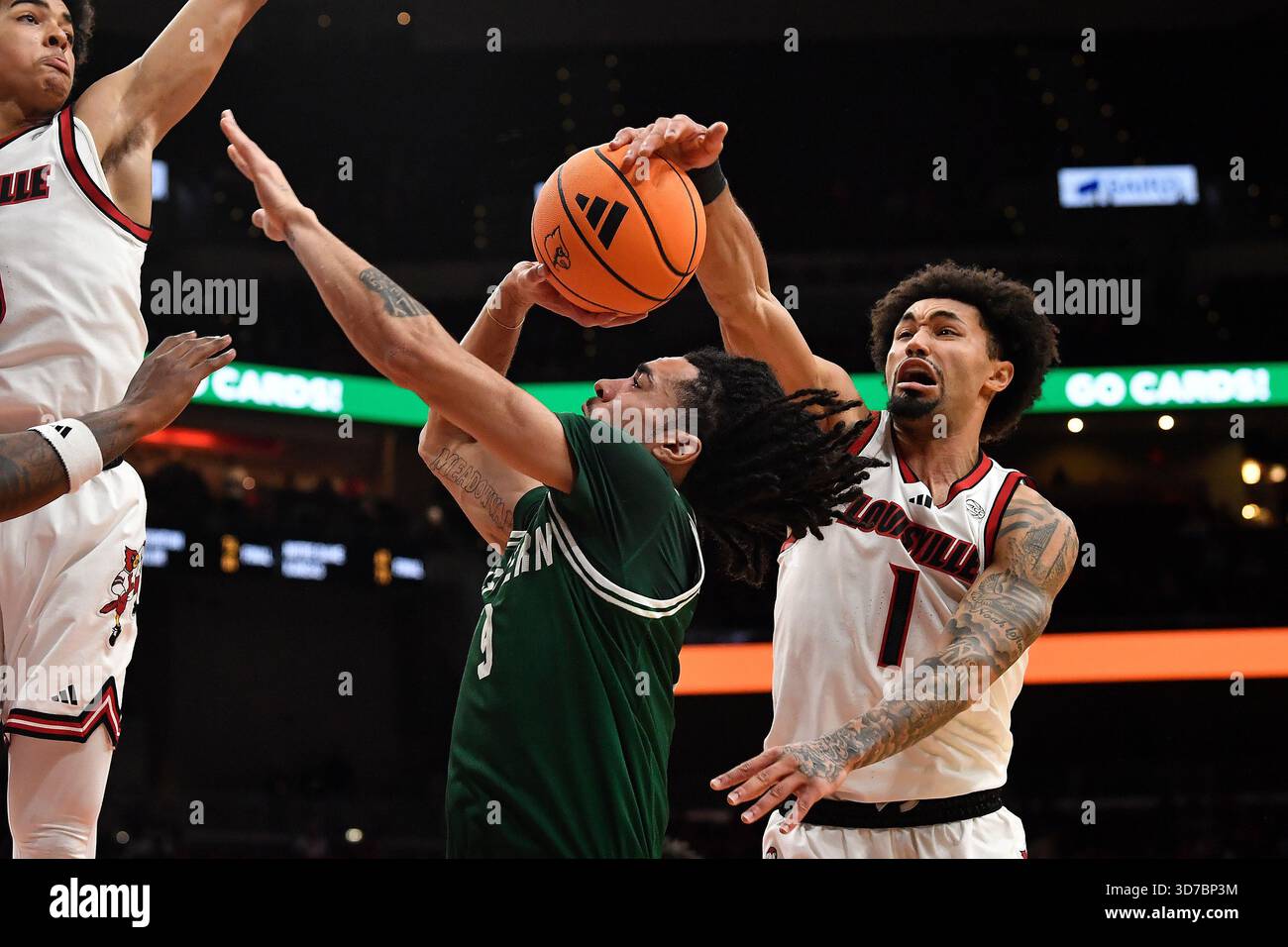 Louisville guard J'Vonne Hadley (1) blocks the shot of Eastern Michigan ...