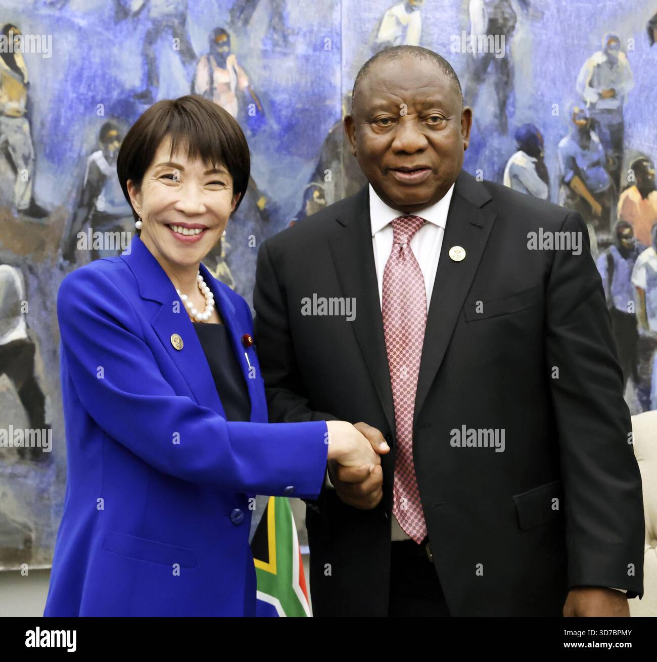 Japanese Prime Minister Sanae Takaichi (L) shakes hands with South African President Cyril ...
