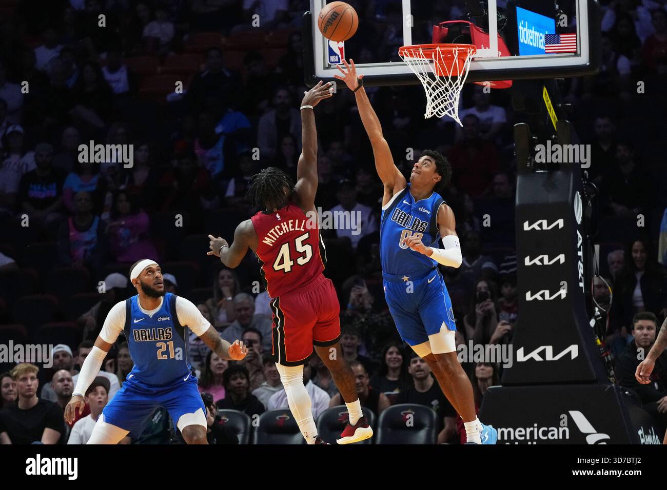 Dallas Mavericks guard Max Christie (00) blocks a shot to the basket by Miami Heat guard Davion ...