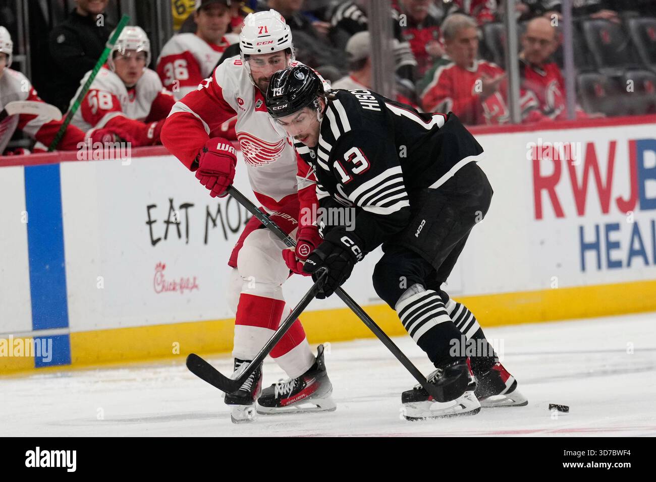 Detroit Red Wings' Dylan Larkin, left, and New Jersey Devils' Nico ...