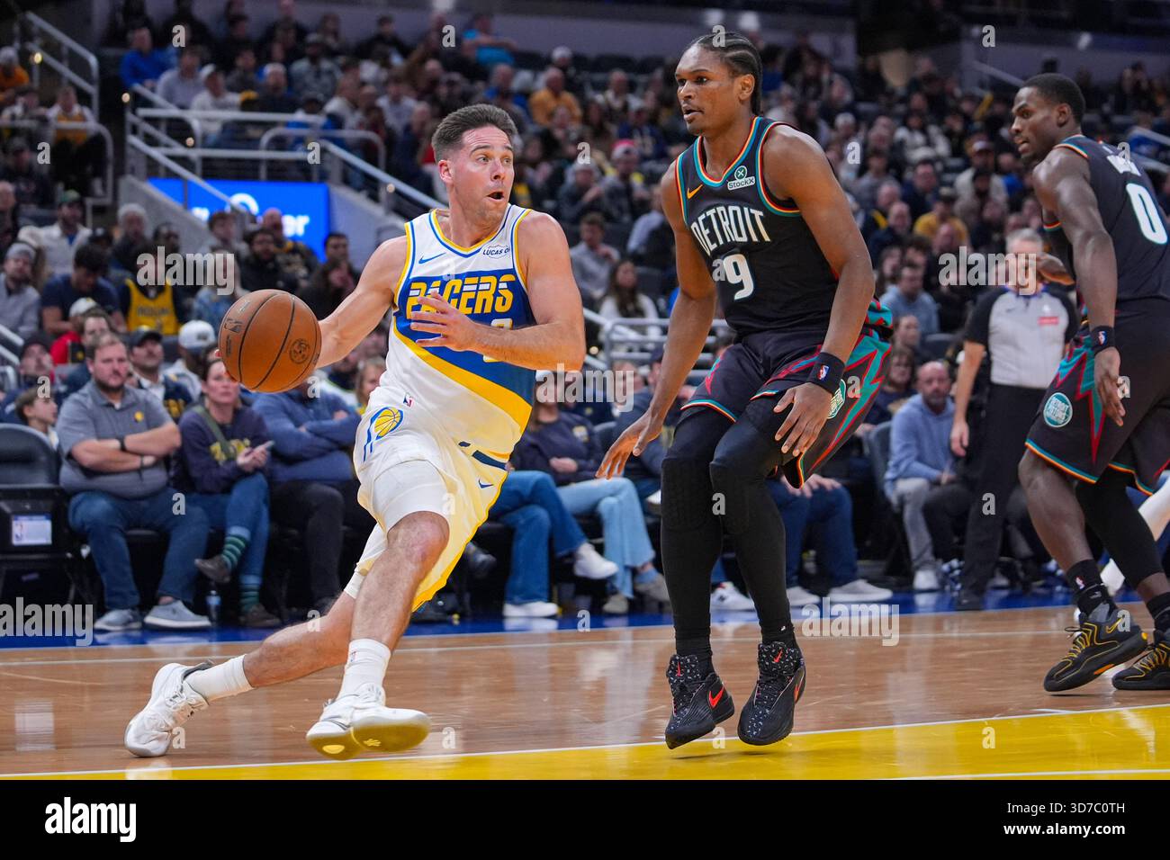 Indiana Pacers guard T.J. McConnell (9) drives on Detroit Pistons guard ...