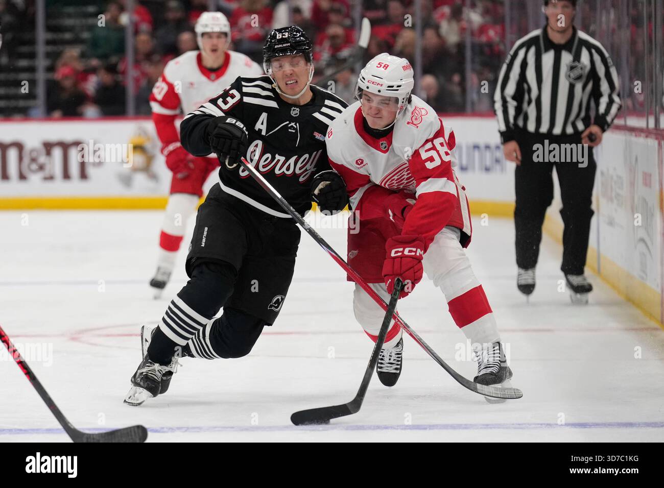 New Jersey Devils' Jesper Bratt, left, and Detroit Red Wings' Emmitt ...