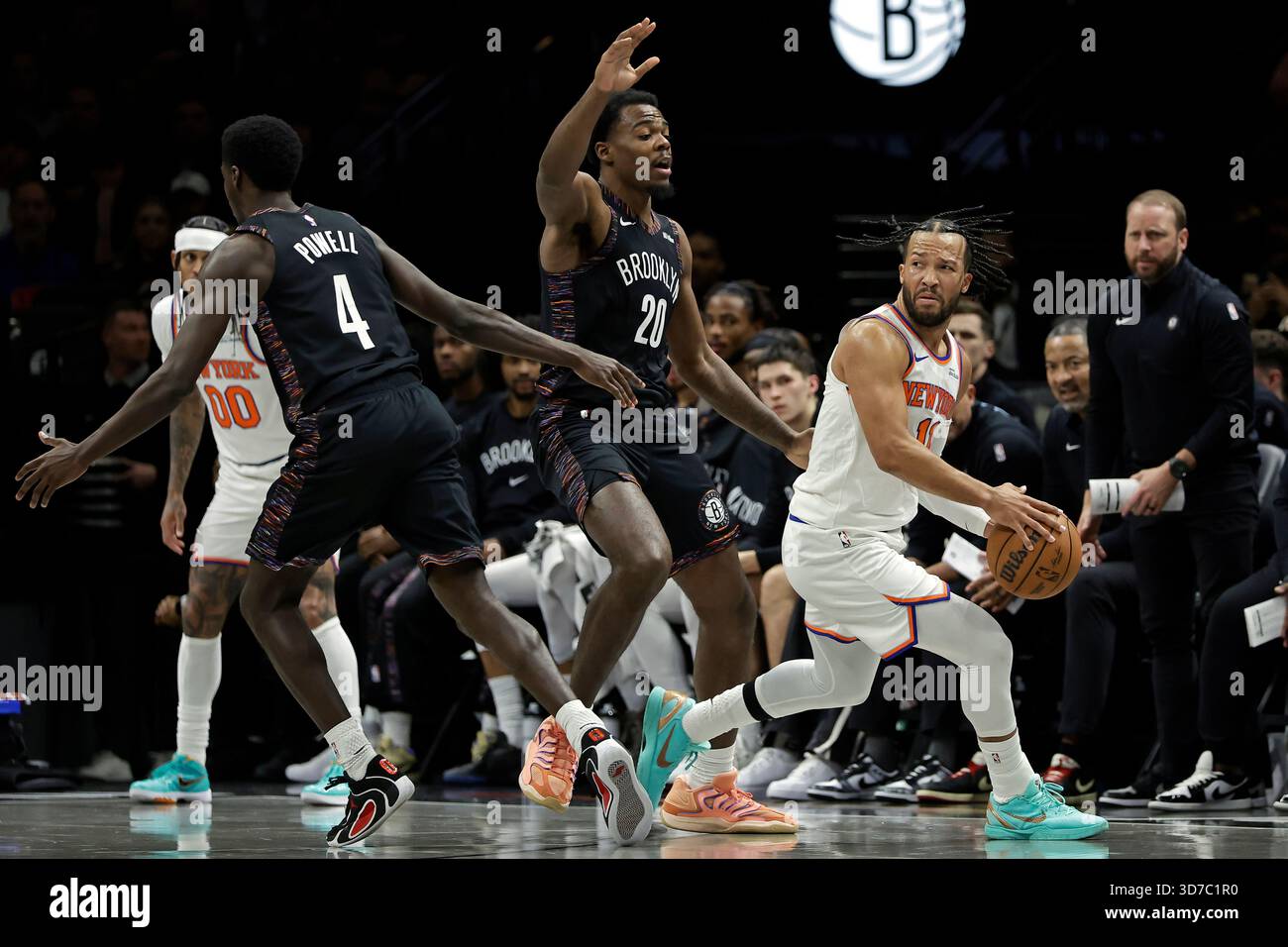 New York Knicks guard Jalen Brunson looks to pass in front of Brooklyn ...