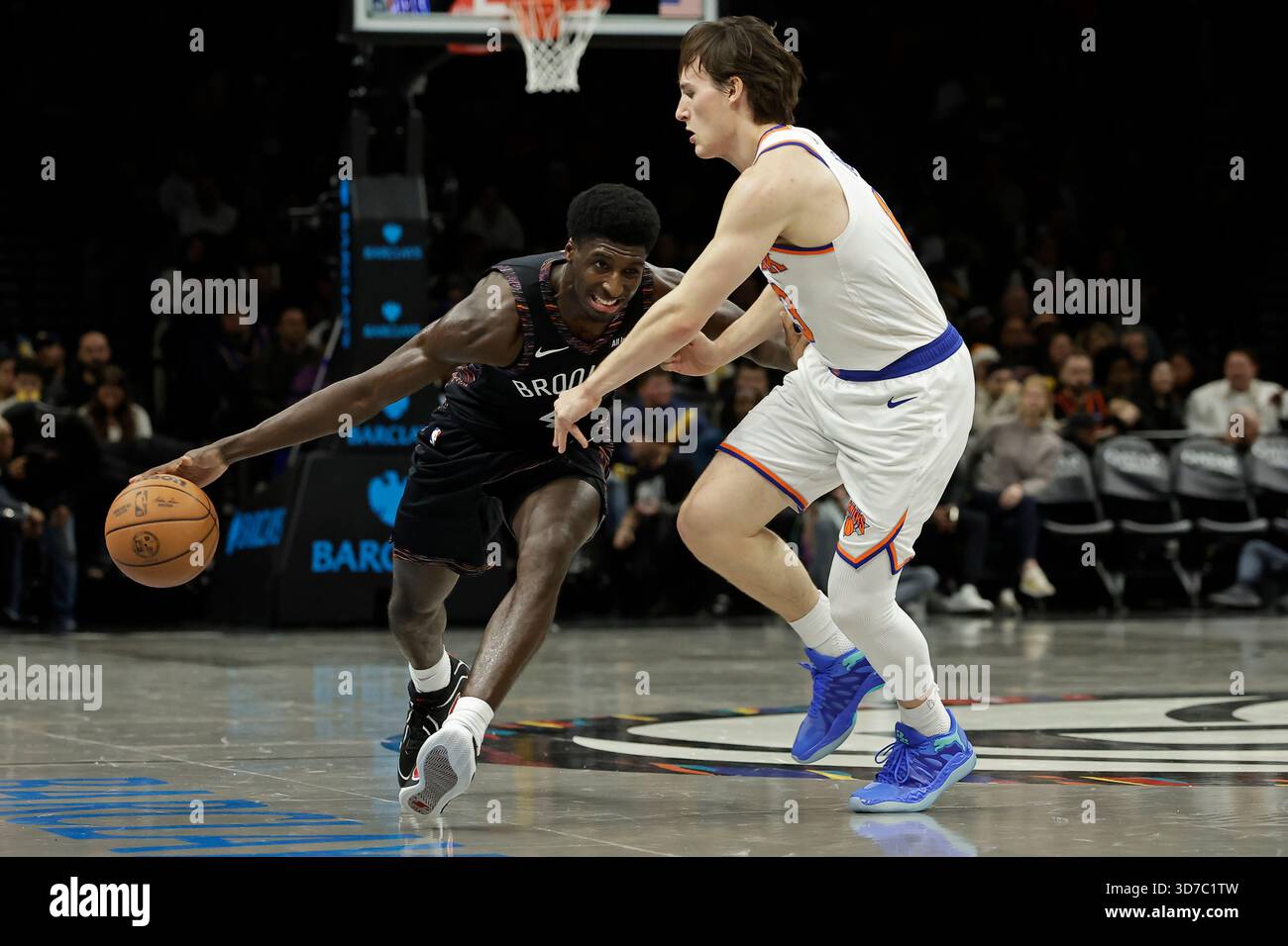 Brooklyn Nets guard Drake Powell drives past New York Knicks guard ...