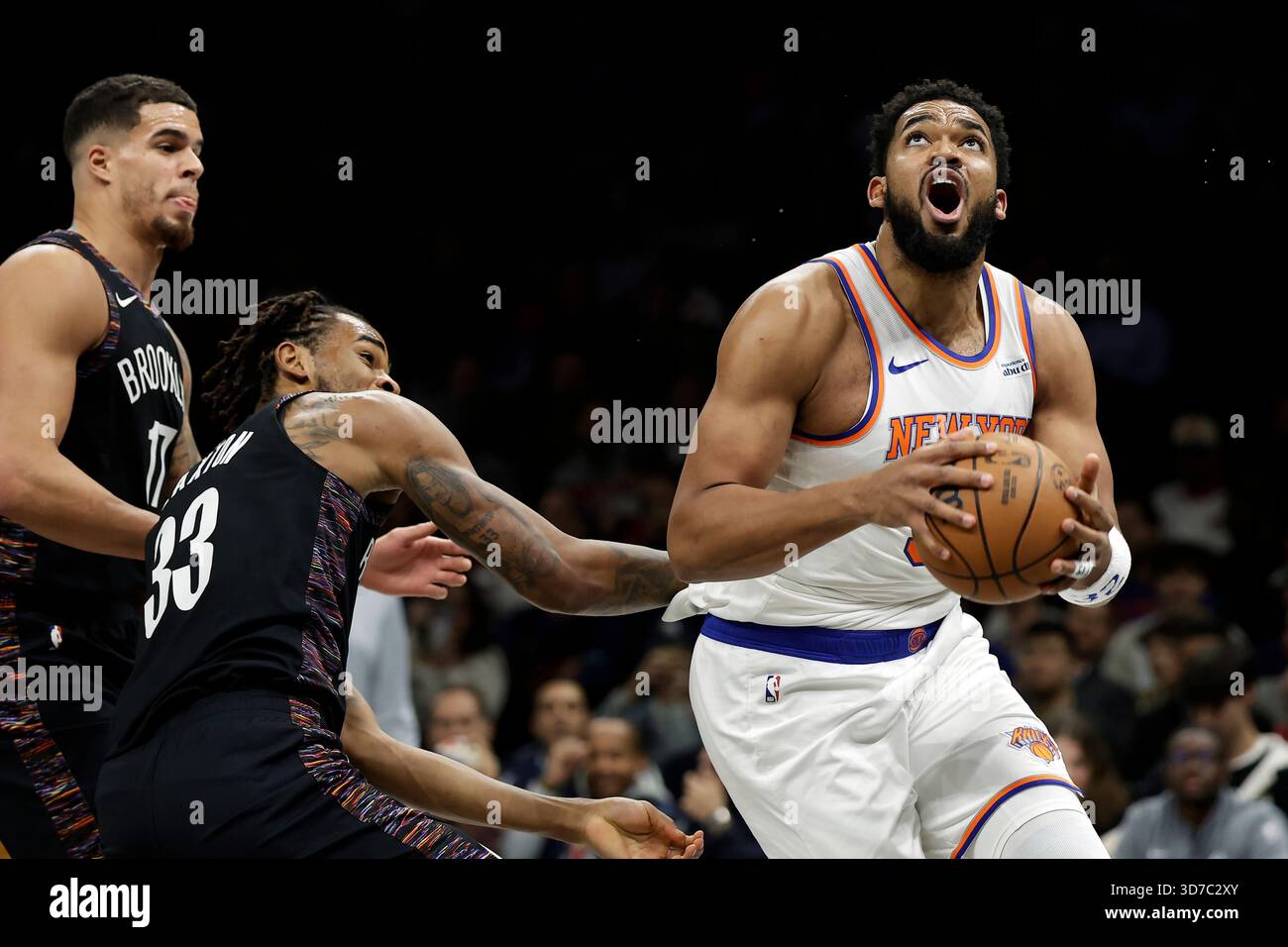 New York Knicks center Karl-Anthony Towns (32) drives past Brooklyn ...