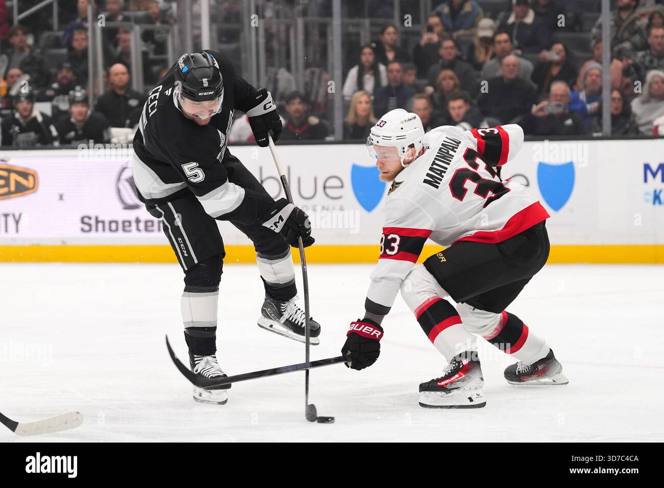 Los Angeles Kings defenseman Cody Ceci (5) shoots under defense by ...