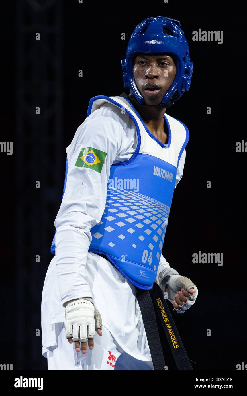 Henrique Marques Rodrigues Fernandes from Brazil (Blue) seen in action ...