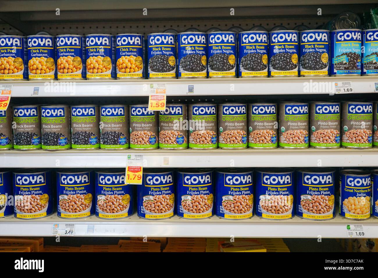Aisle with shelves of Goya brand canned beans inside a Smith's grocery ...