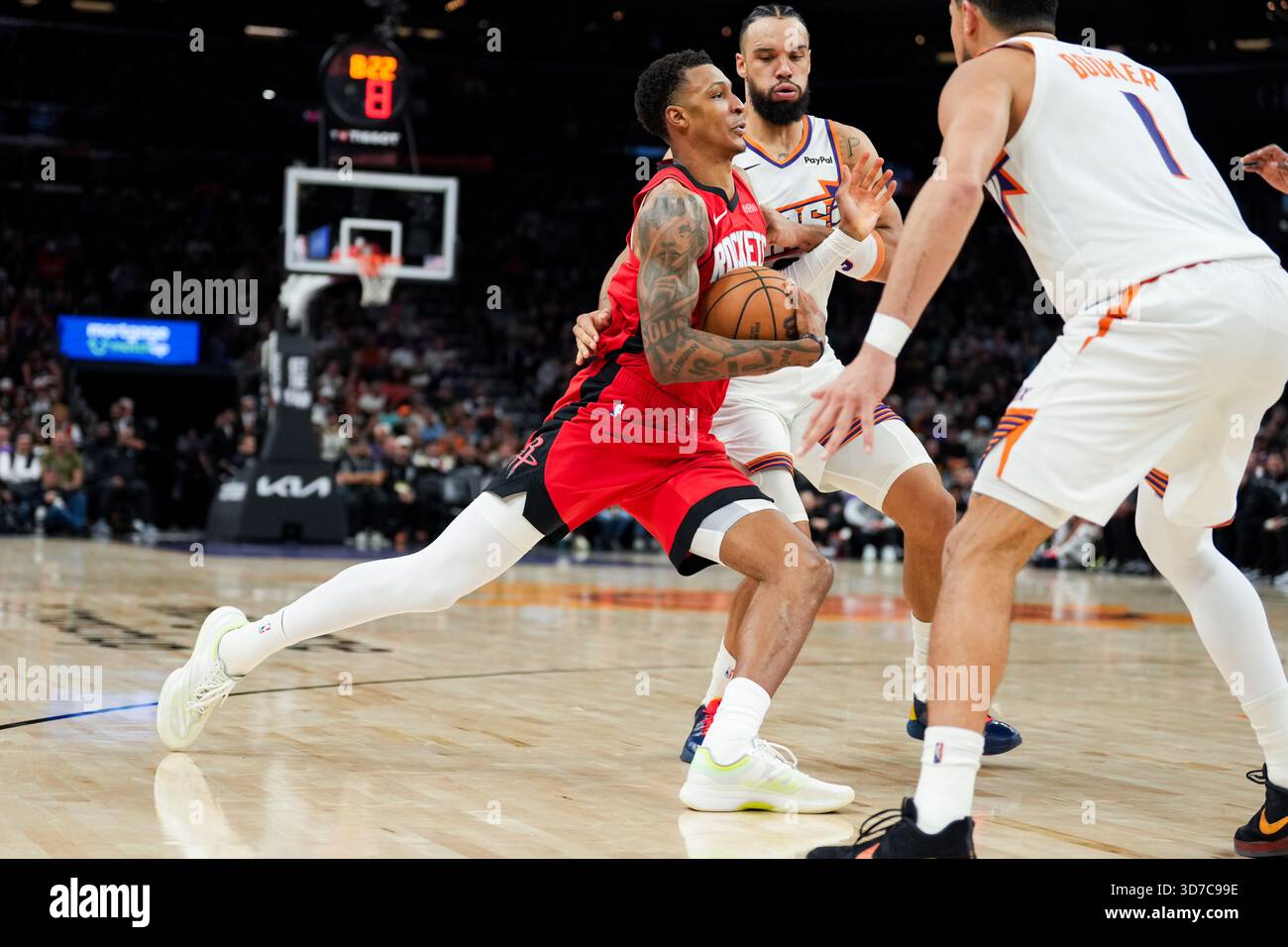 Houston Rockets forward Jabari Smith Jr., left, carries the ball past ...