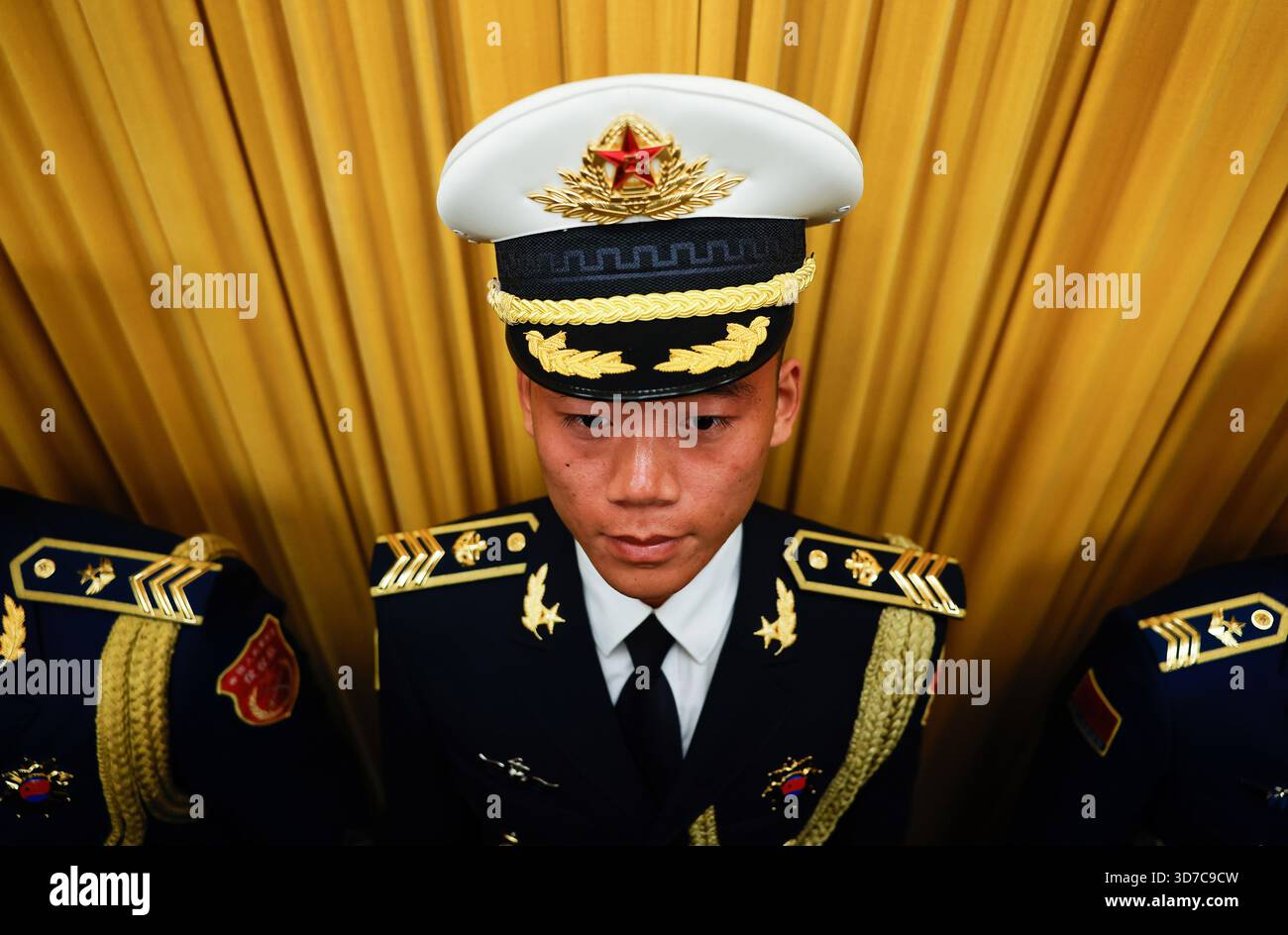 An honor guard member of the People's Liberation Army (PLA) looks on ...
