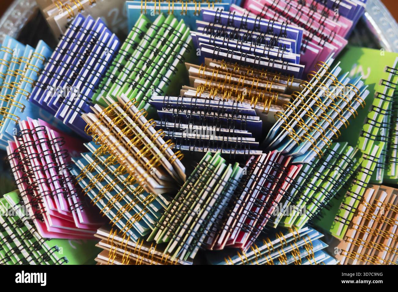 Vibrant, colorful pile of metallic candy wrappers creates fun abstract ...