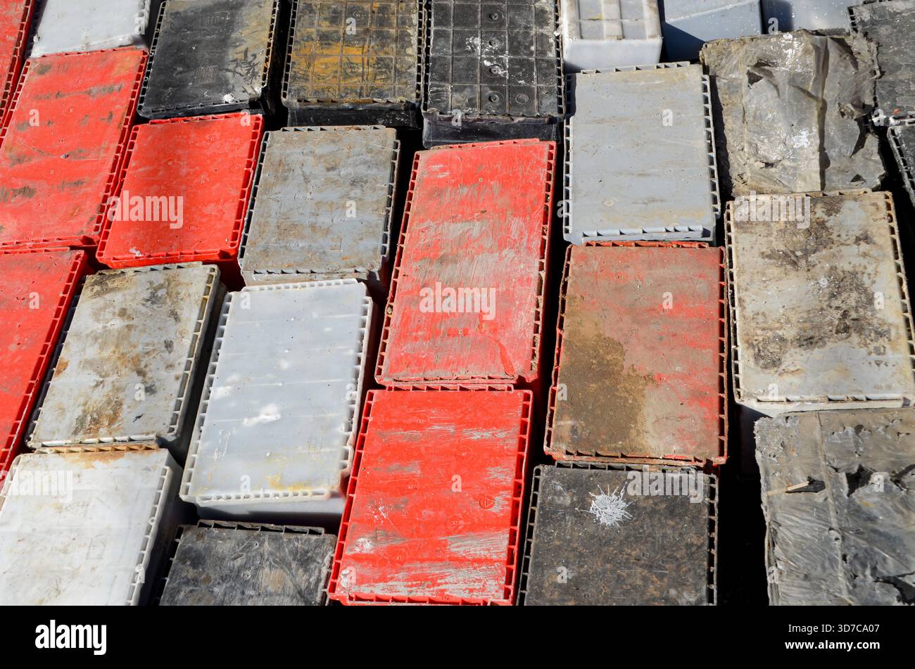 Close-up, full-frame view of discarded industrial battery casings ...