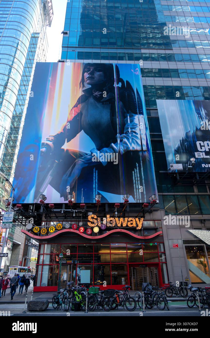 Busy times square scene in New York city with illuminated billboards ...