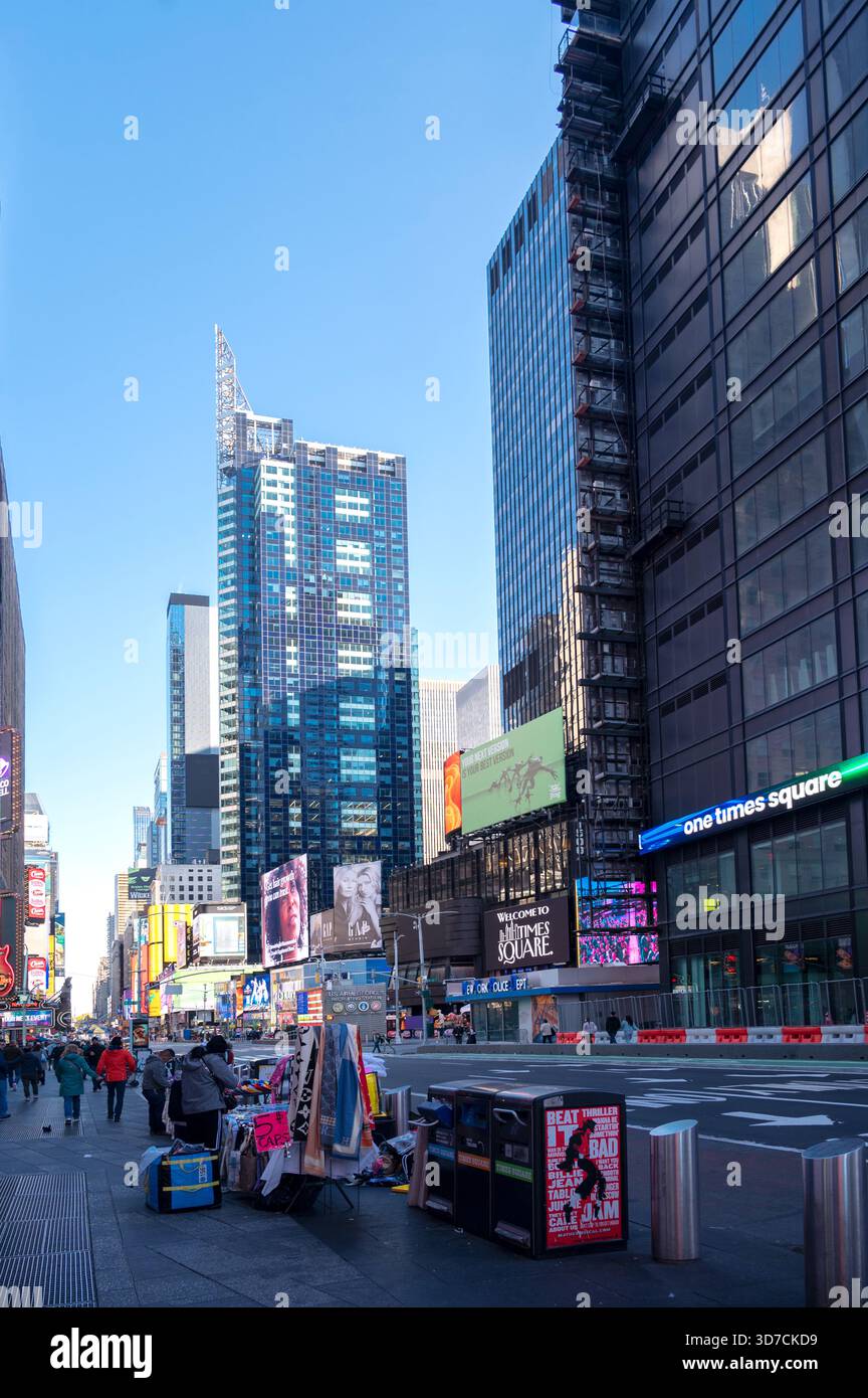 Busy times square scene in New York city with illuminated billboards ...