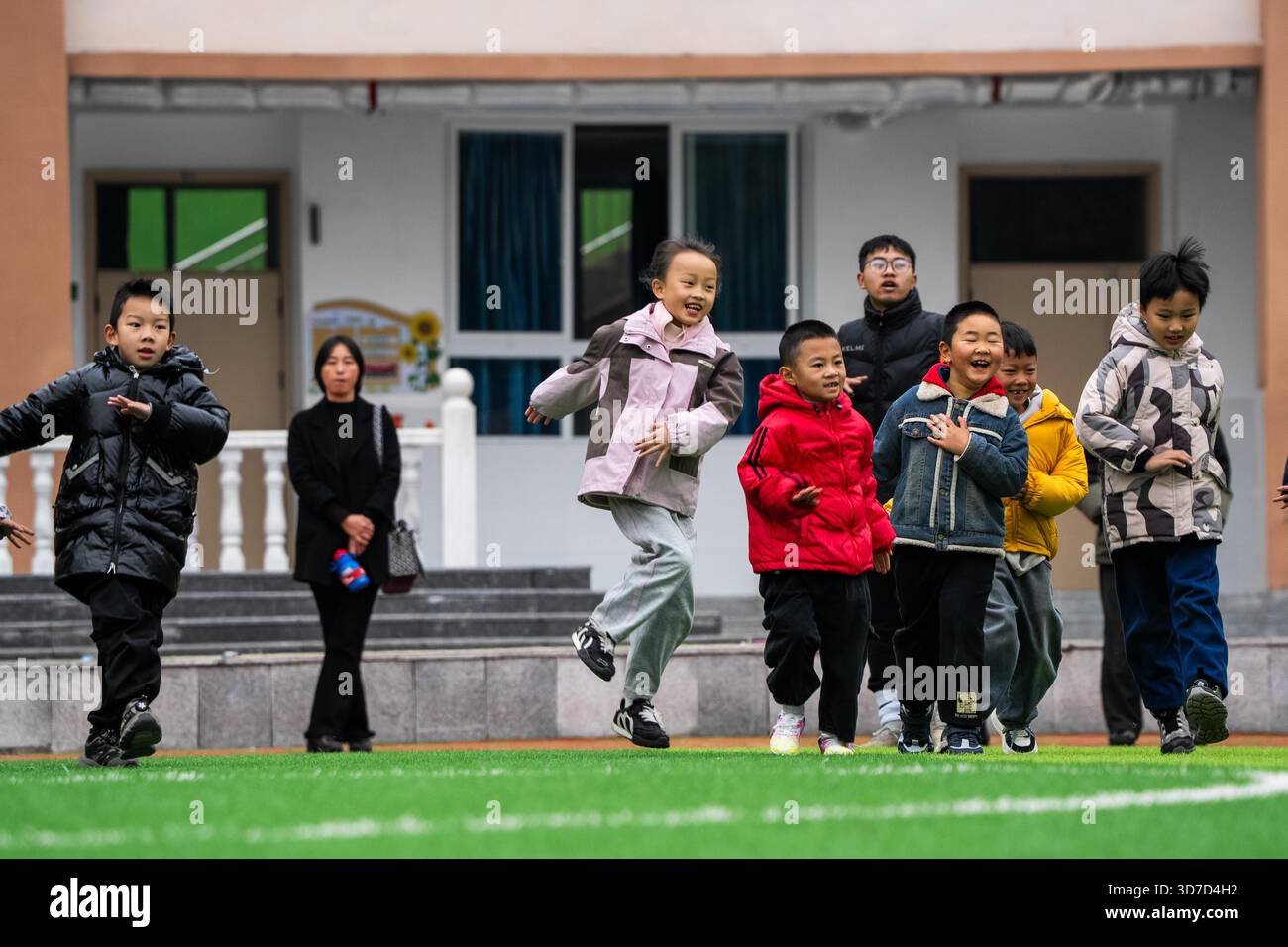 Children learn to play football at a shool in Bijie City, southwest ...