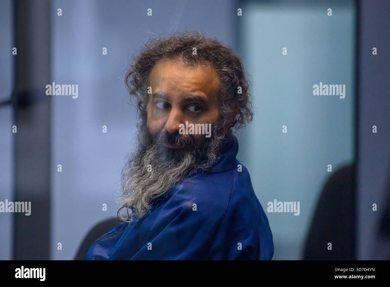 Taleb al-Abdulmohsen sits in a glass box during the trial at the ...